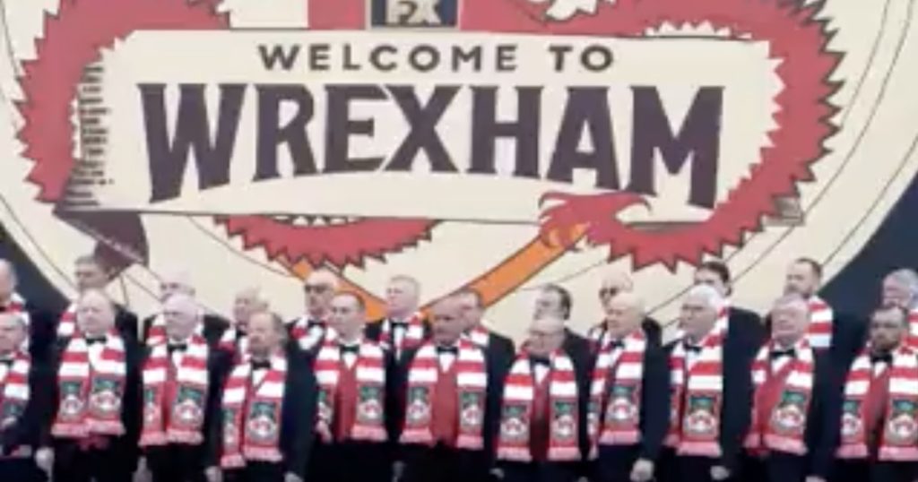 Watch: Male choir's stunning performance in front of giant Wrexham mural