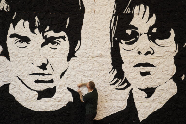 Giant Oasis ‘Wonder Wall’ made of bucket hats unveiled in Cardiff
